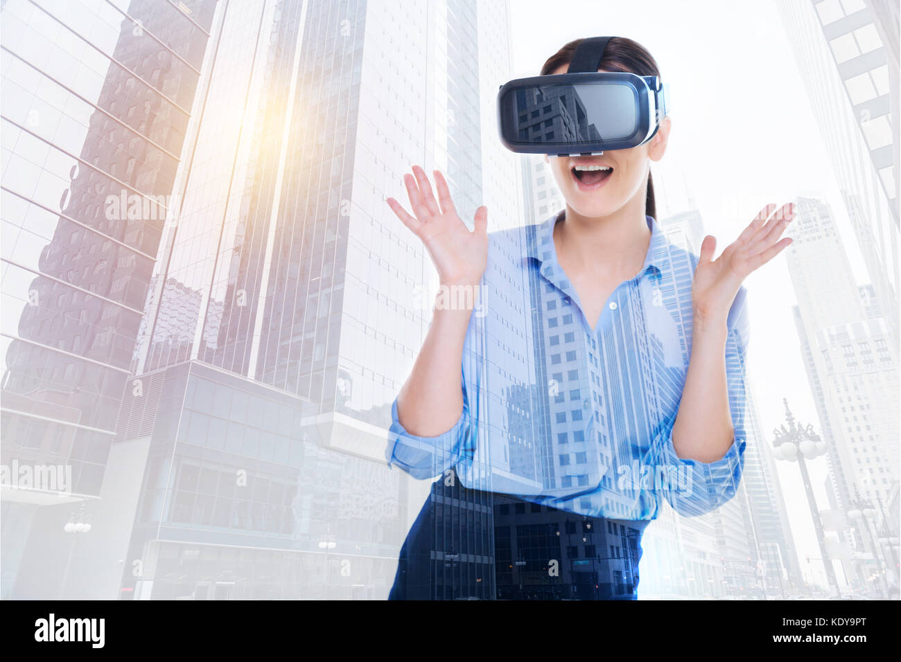 Cheerful woman being excited to play with VR Stock Photo - Alamy