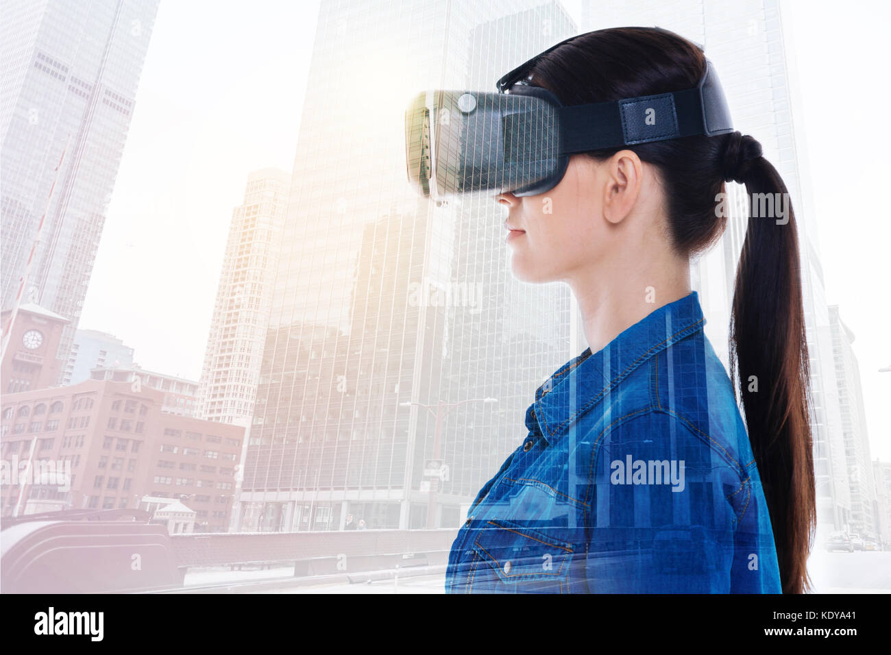 Side view of charming woman in VR headset Stock Photo - Alamy