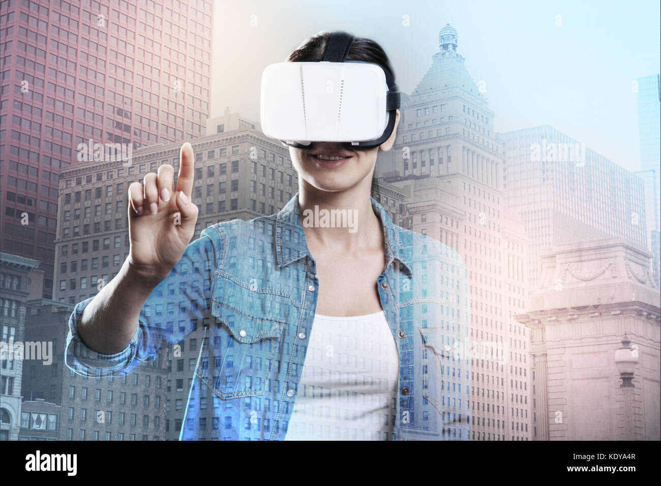 Charming woman wearing white VR headset Stock Photo - Alamy