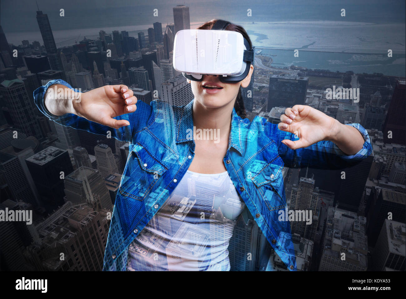 Young woman playing VR action game Stock Photo - Alamy