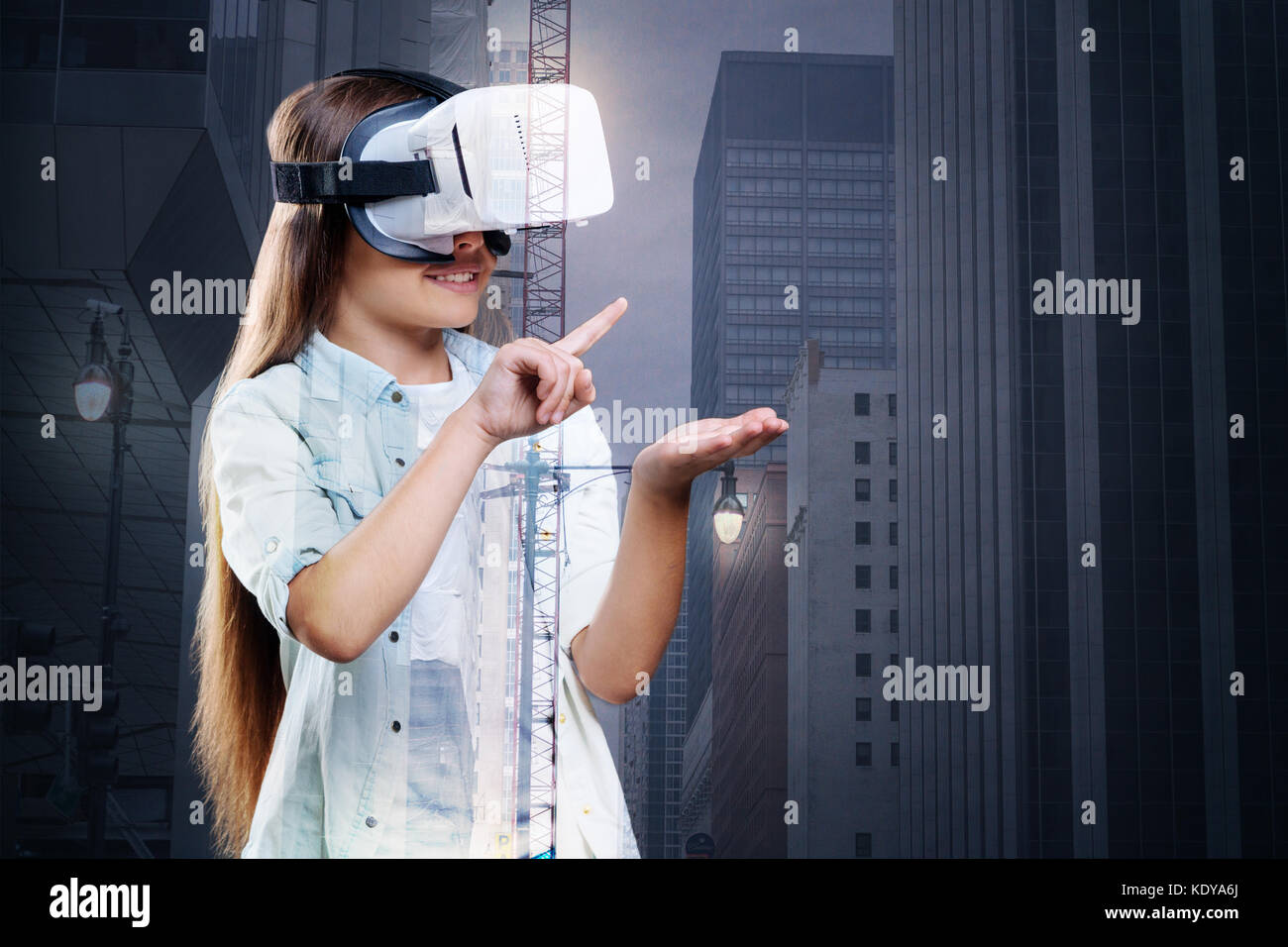 Adorable dark-haired girl playing VR game Stock Photo - Alamy
