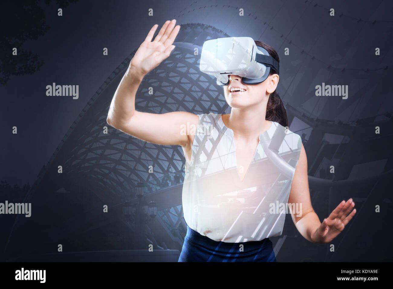 Charming woman being involved into playing VR game Stock Photo - Alamy