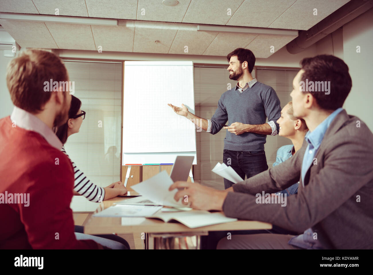 Smart attractive man standing near the whiteboard Stock Photo - Alamy