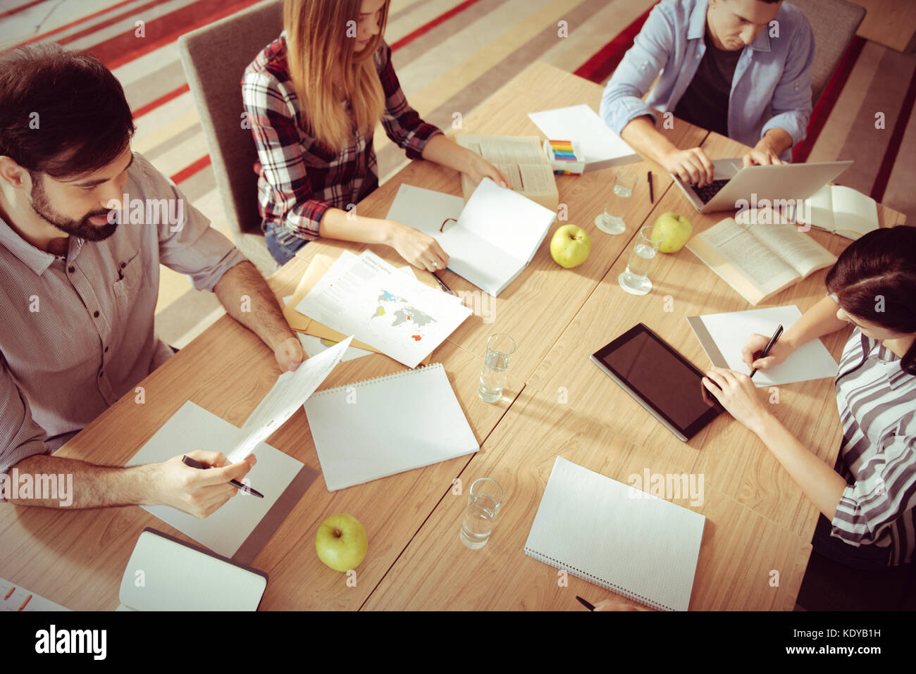 Nice smart people concentrating on their tasks Stock Photo - Alamy