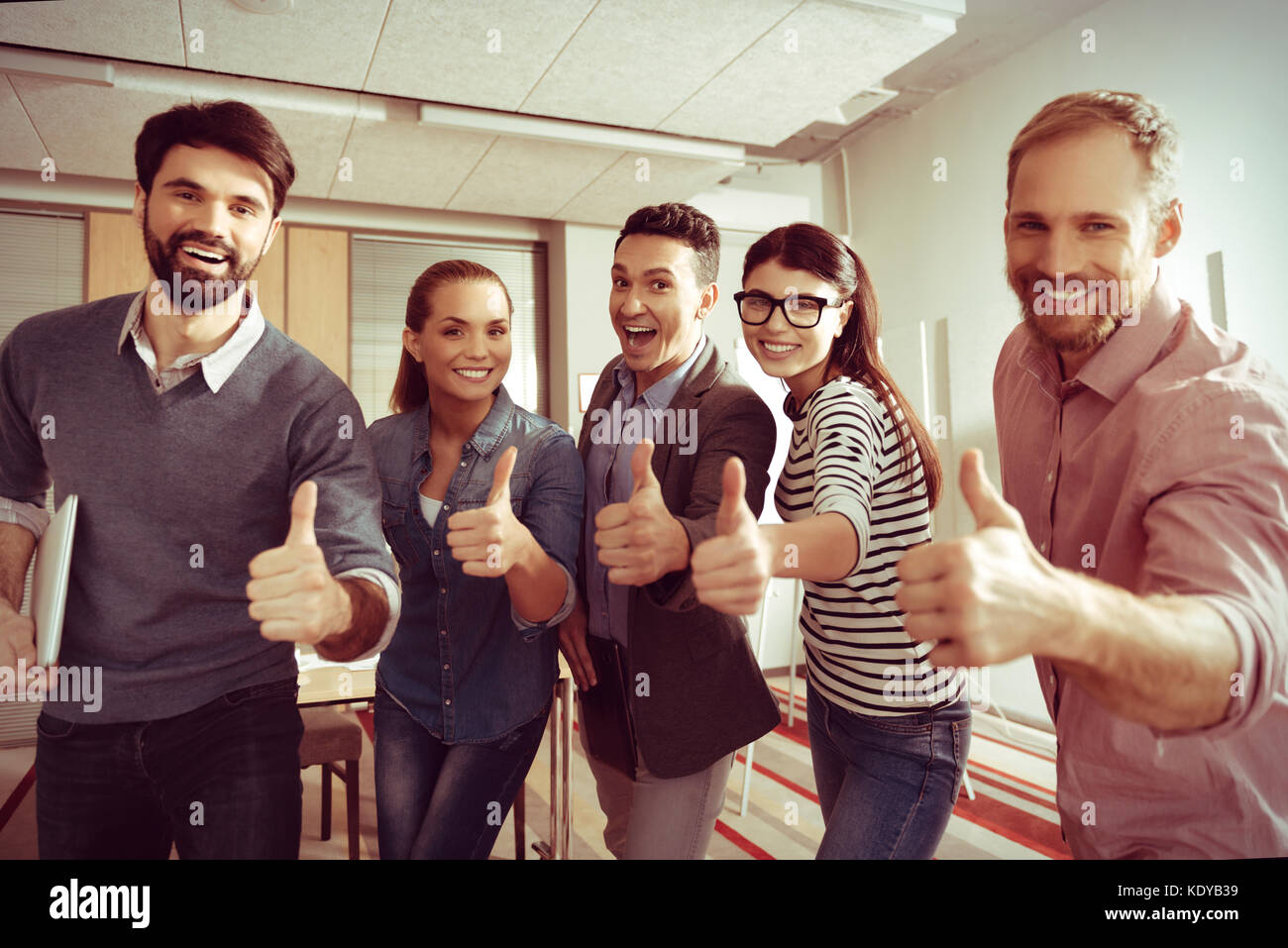 Happy positive people standing together Stock Photo - Alamy