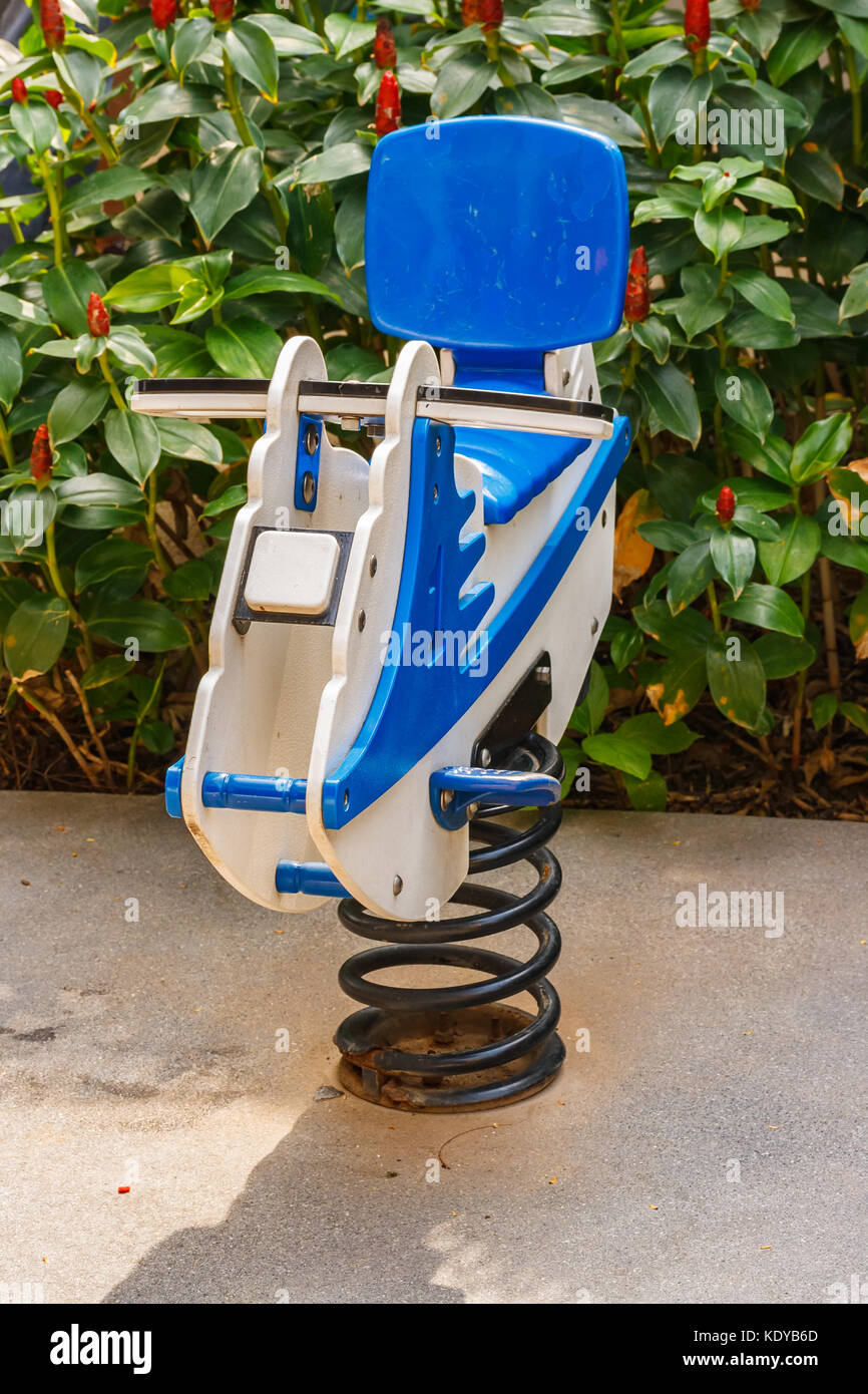 spring rider onplayground Stock Photo - Alamy