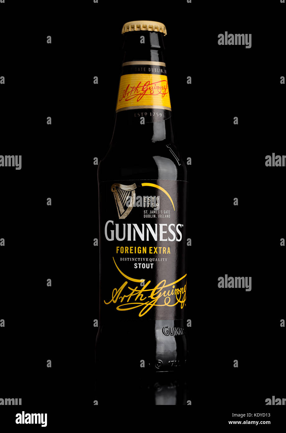 LONDON,UK - MARCH 21, 2017 : Bottle of Guinness foreign extra beer on black background.Guinness ...