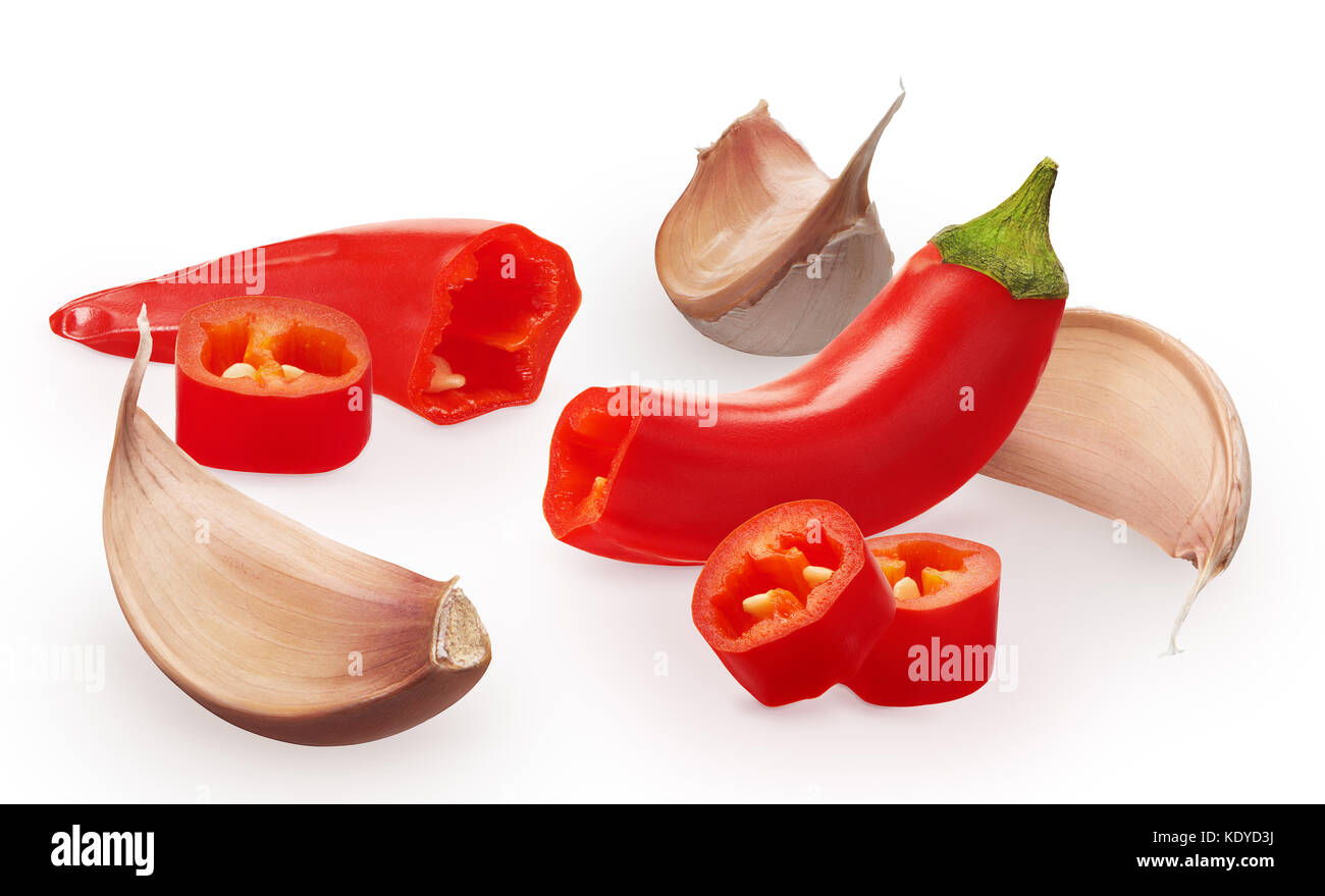 Three cloves of garlic and cut red chili pepper vegetables isolated on ...