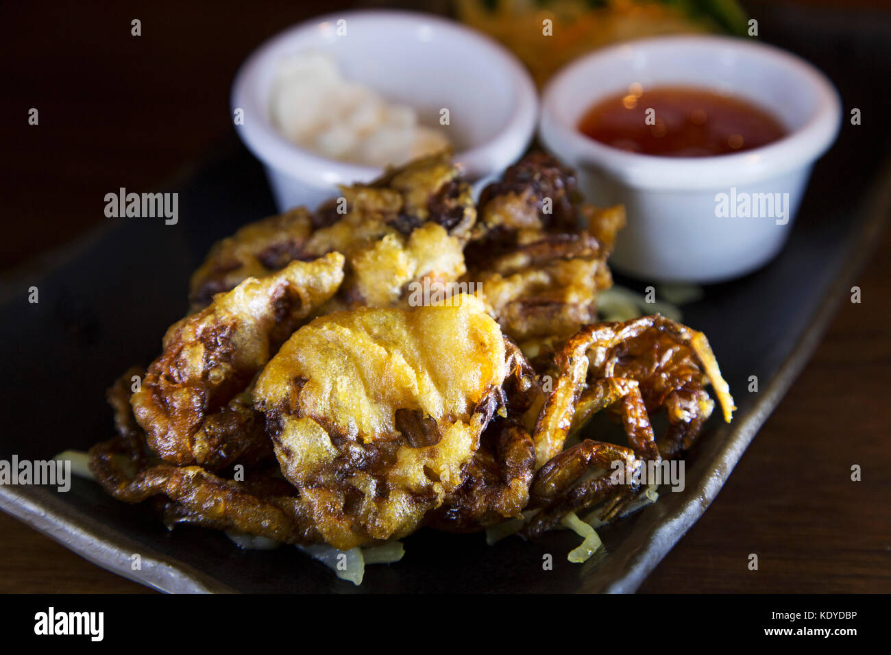 Soft-shelled crab served in a batter with mayo and sweet chili dips ...