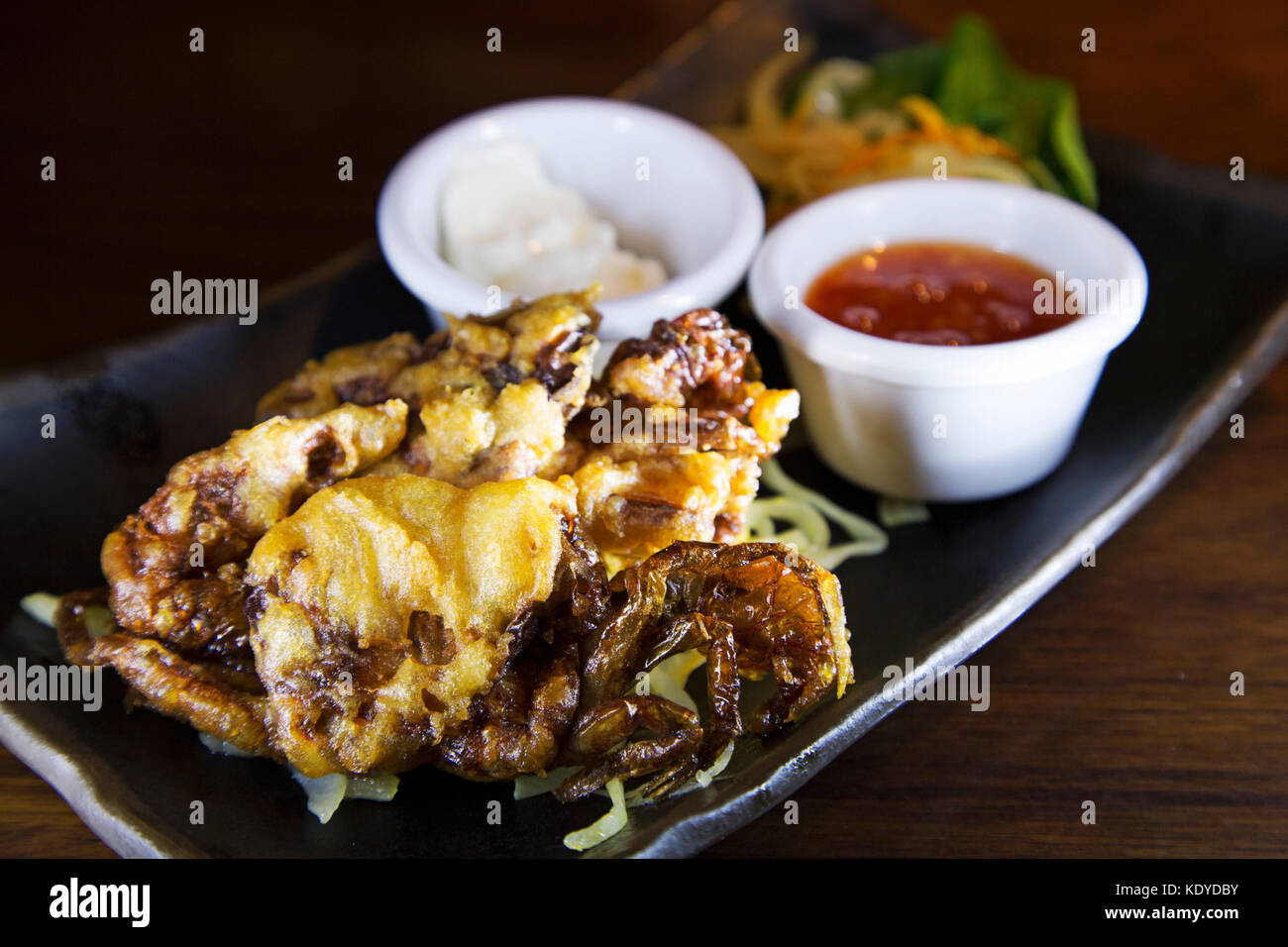 Soft-shelled crab served in a batter with mayo and sweet chili dips ...