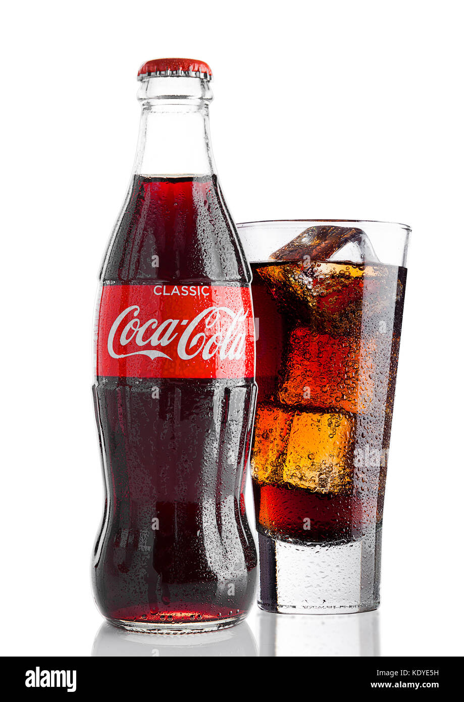 LONDON,UK - MARCH 30, 2017 : Bottle and glass with ice cubes of Coca ...
