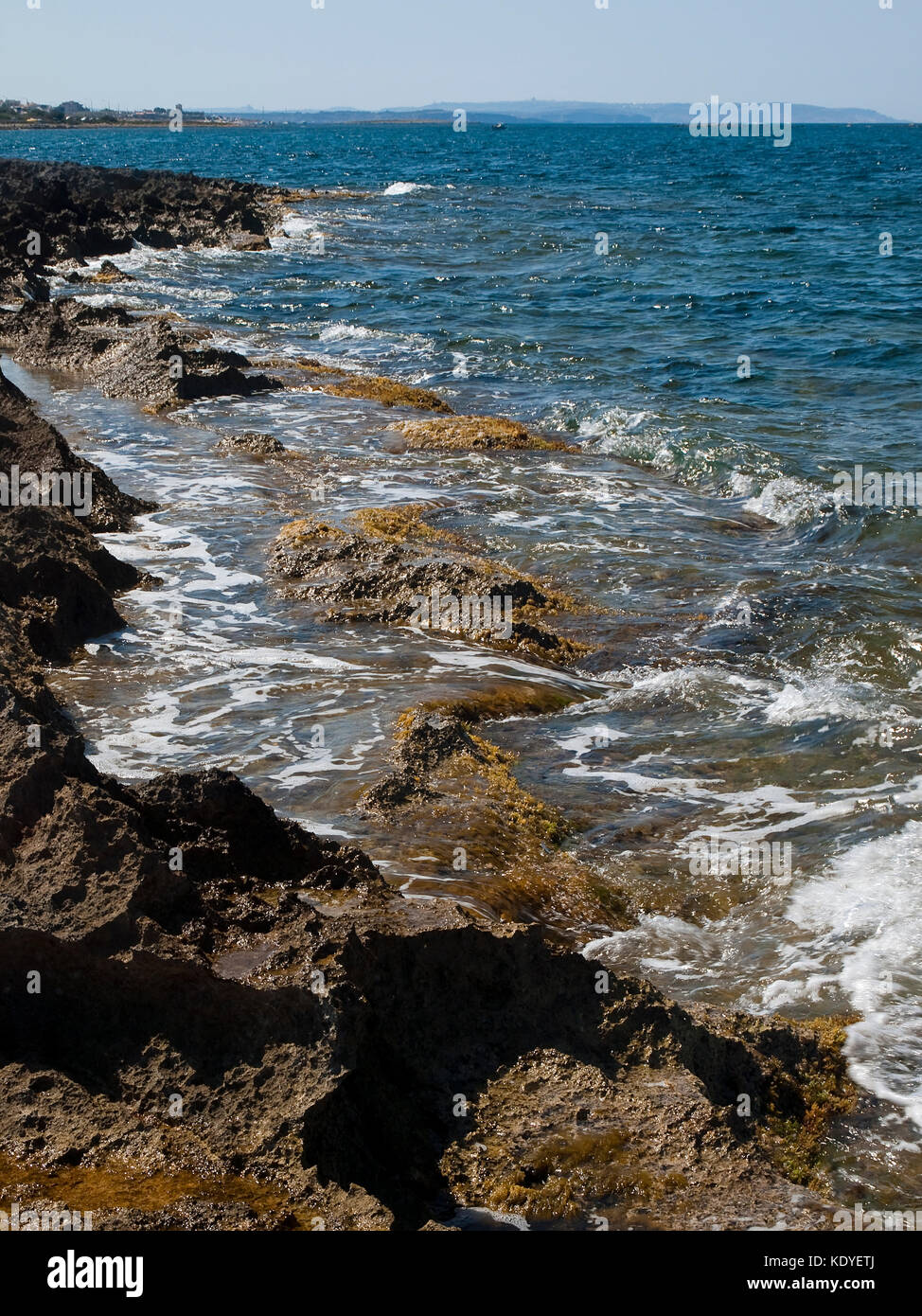Detail of a rocky reef in Malta with beautiful crystal clear ocean ...