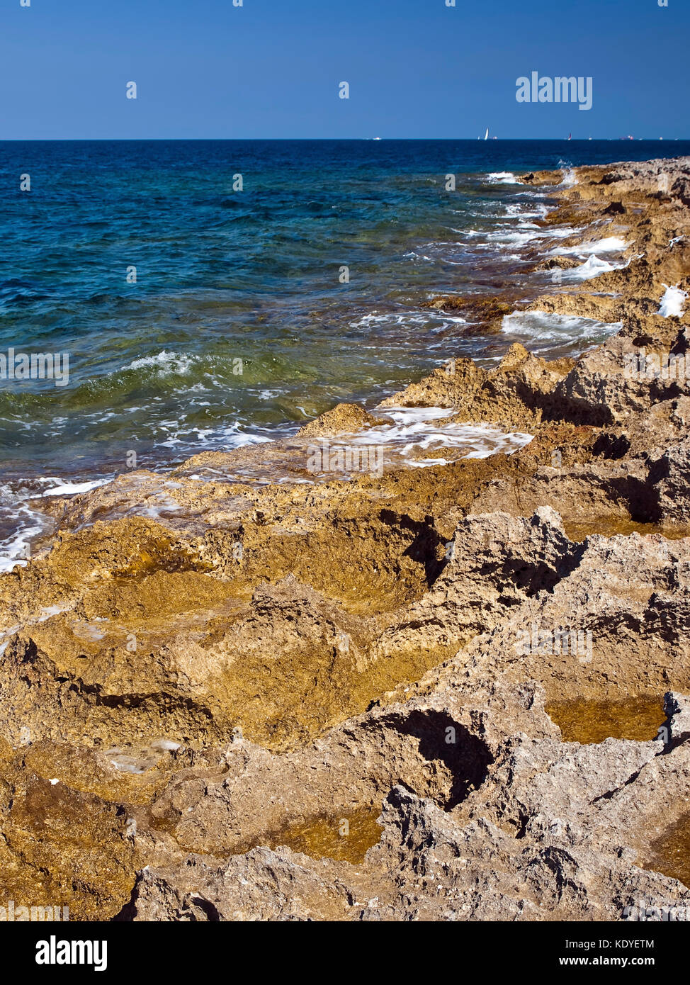 Detail of a rocky reef in Malta with beautiful crystal clear ocean ...