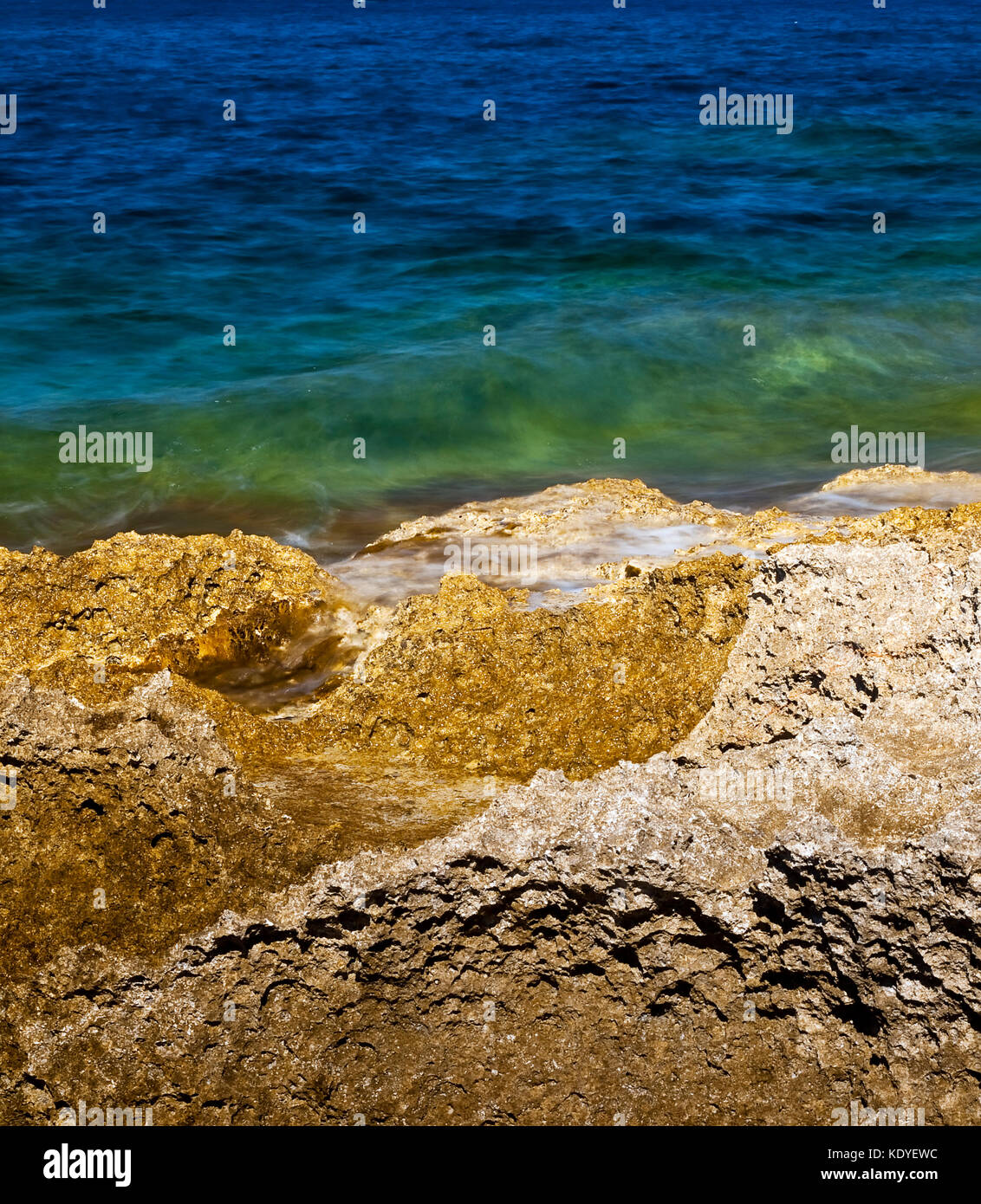 Detail of a rocky reef in Malta with beautiful crystal clear ocean ...