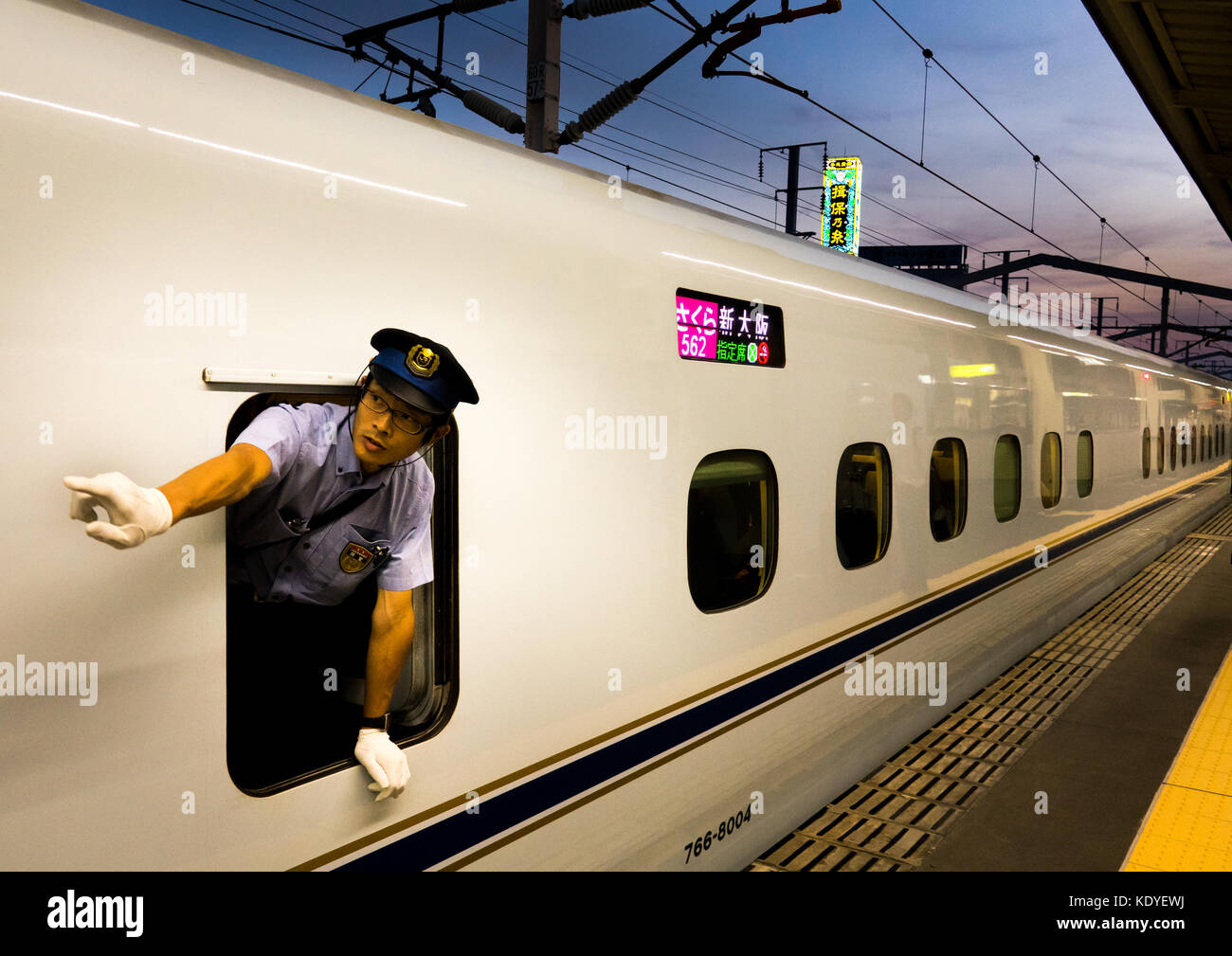 Train conductor by the window of N700 Shinkansen from Himeji to Osaka ...