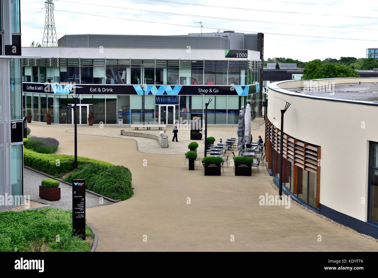 Modern English office building with adjacent planting and paved area ...