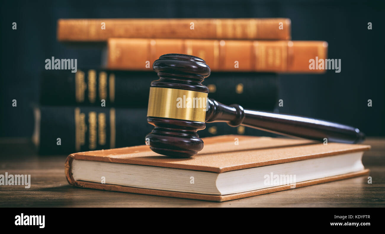 Law gavel on a book, law books background, wooden desk Stock Photo - Alamy