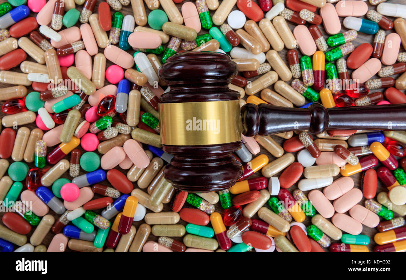 Law and drugs concept. Judge gavel on colorful pills background Stock ...