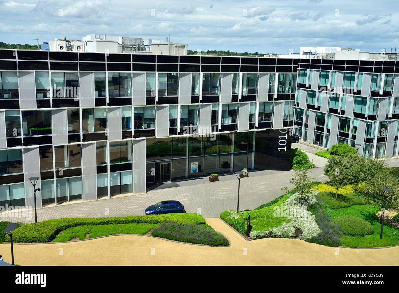 Modern English office building with adjacent planting and paved area ...