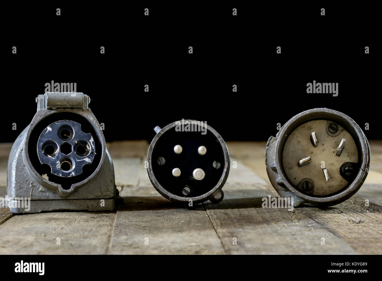 Old plug and socket high voltage. Old electrical accessories. Wooden ...