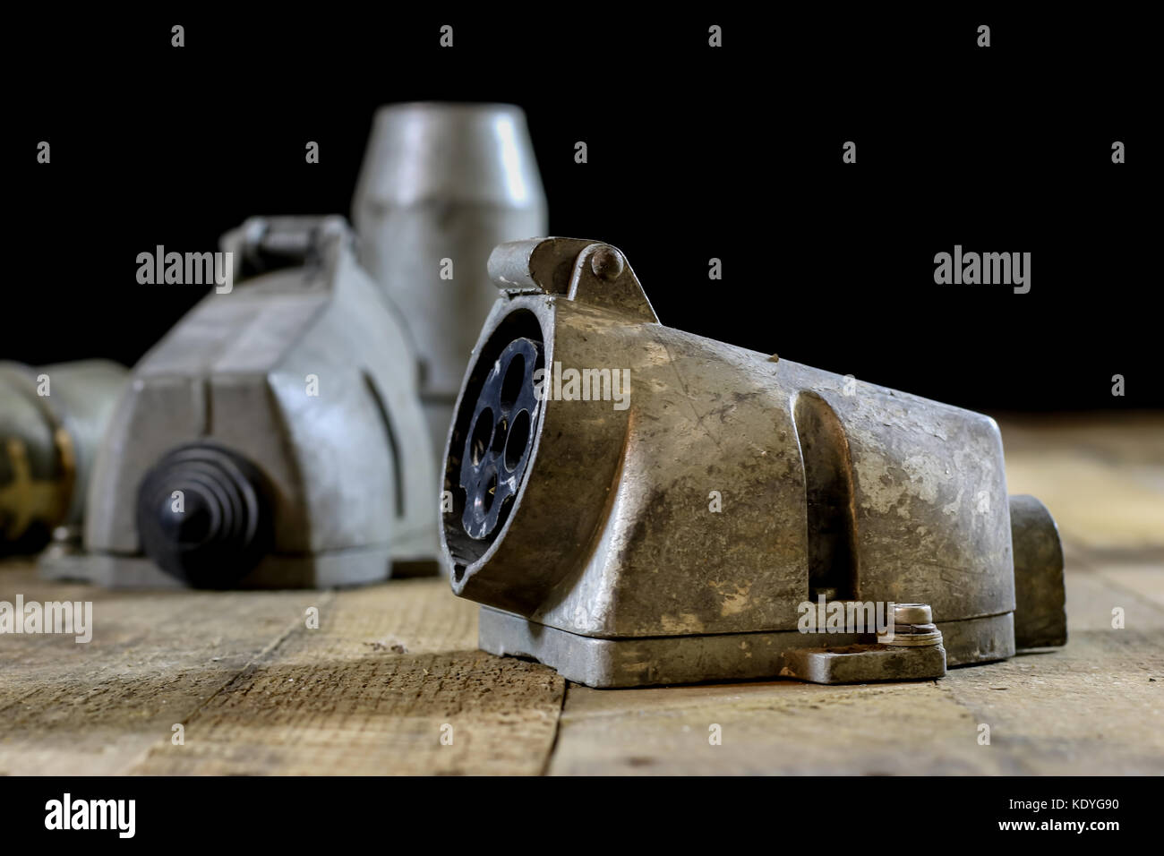 Old plug and socket high voltage. Old electrical accessories. Wooden ...