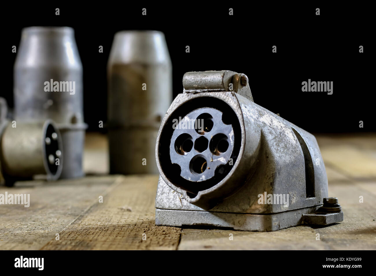 Old plug and socket high voltage. Old electrical accessories. Wooden ...