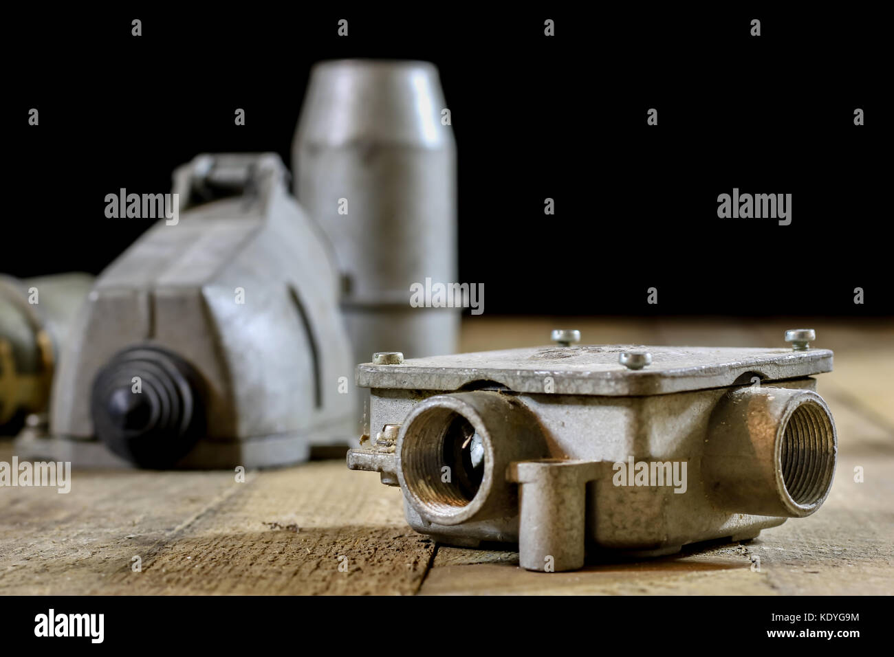 Old plug and socket high voltage. Old electrical accessories. Wooden ...