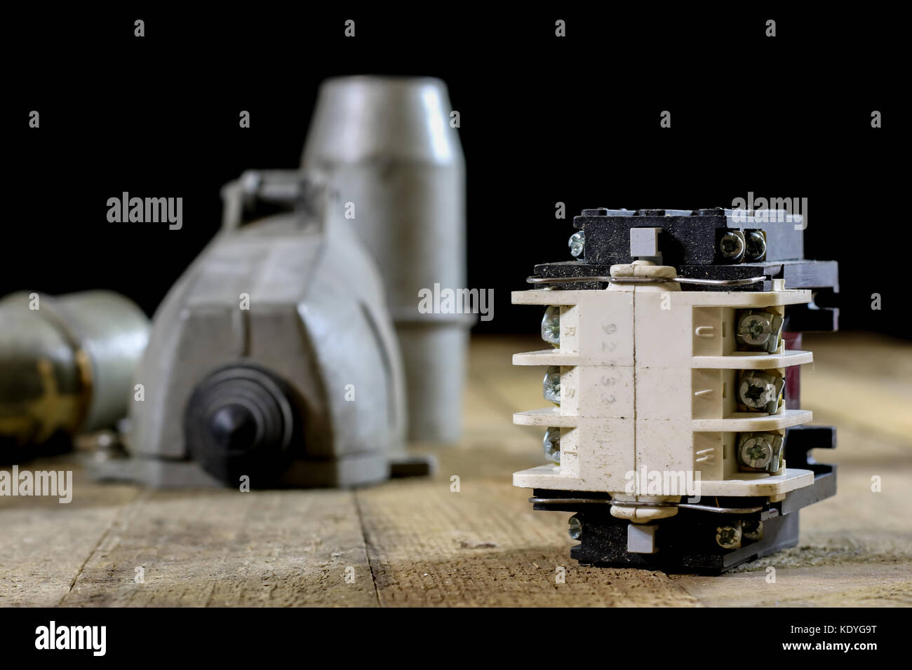 Old plug and socket high voltage. Old electrical accessories. Wooden ...