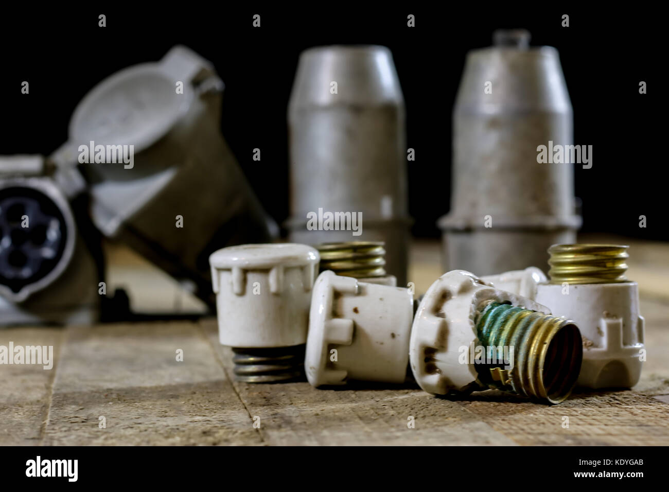 Old plug and socket high voltage. Old electrical accessories. Wooden ...