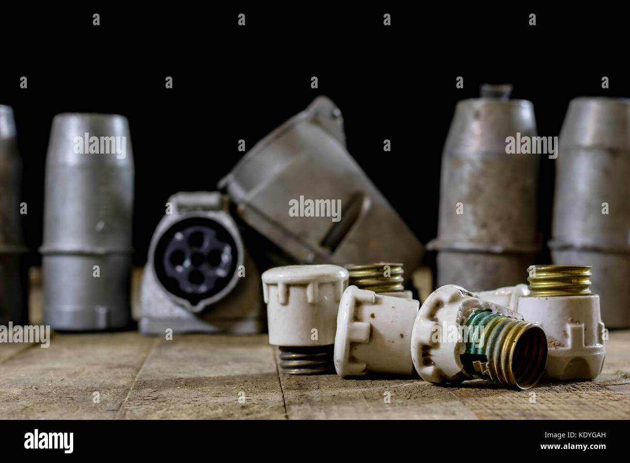 Old plug and socket high voltage. Old electrical accessories. Wooden ...