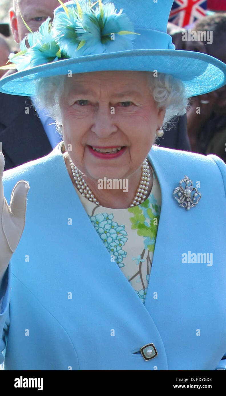 LONDON, ENGLAND - MARCH 29: Crowds cheer as Queen Elizabeth II arrives ...