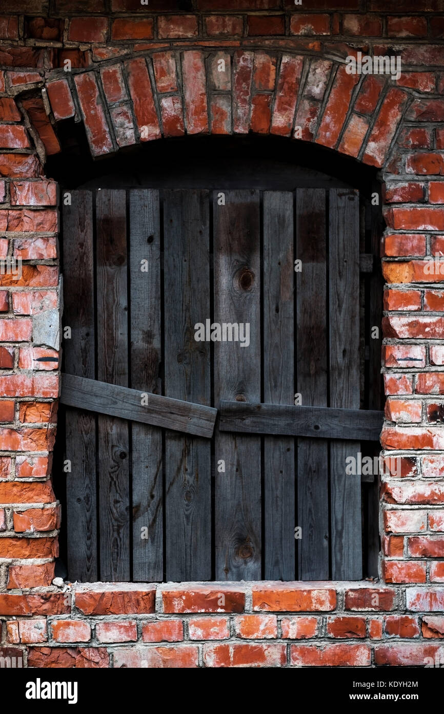 Old boarded up windows in a red face brick building Stock Photo - Alamy