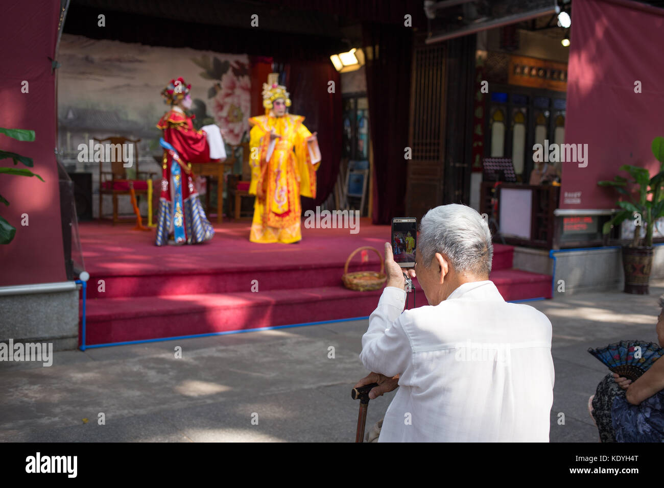 guangzhou,china - Aug,16,2017: Old man watching contonese opera show ...