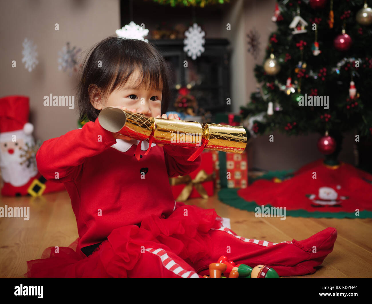 happy santa baby girl at home Stock Photo - Alamy