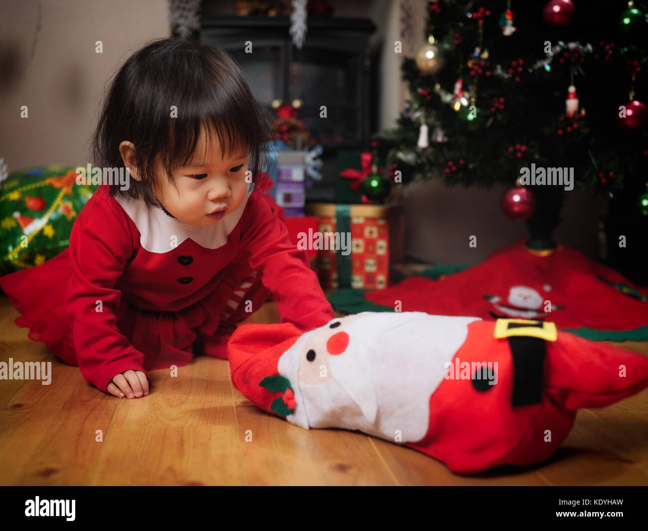 happy santa baby girl at home Stock Photo - Alamy