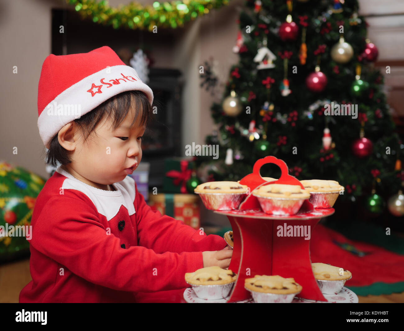happy santa baby girl at home Stock Photo - Alamy