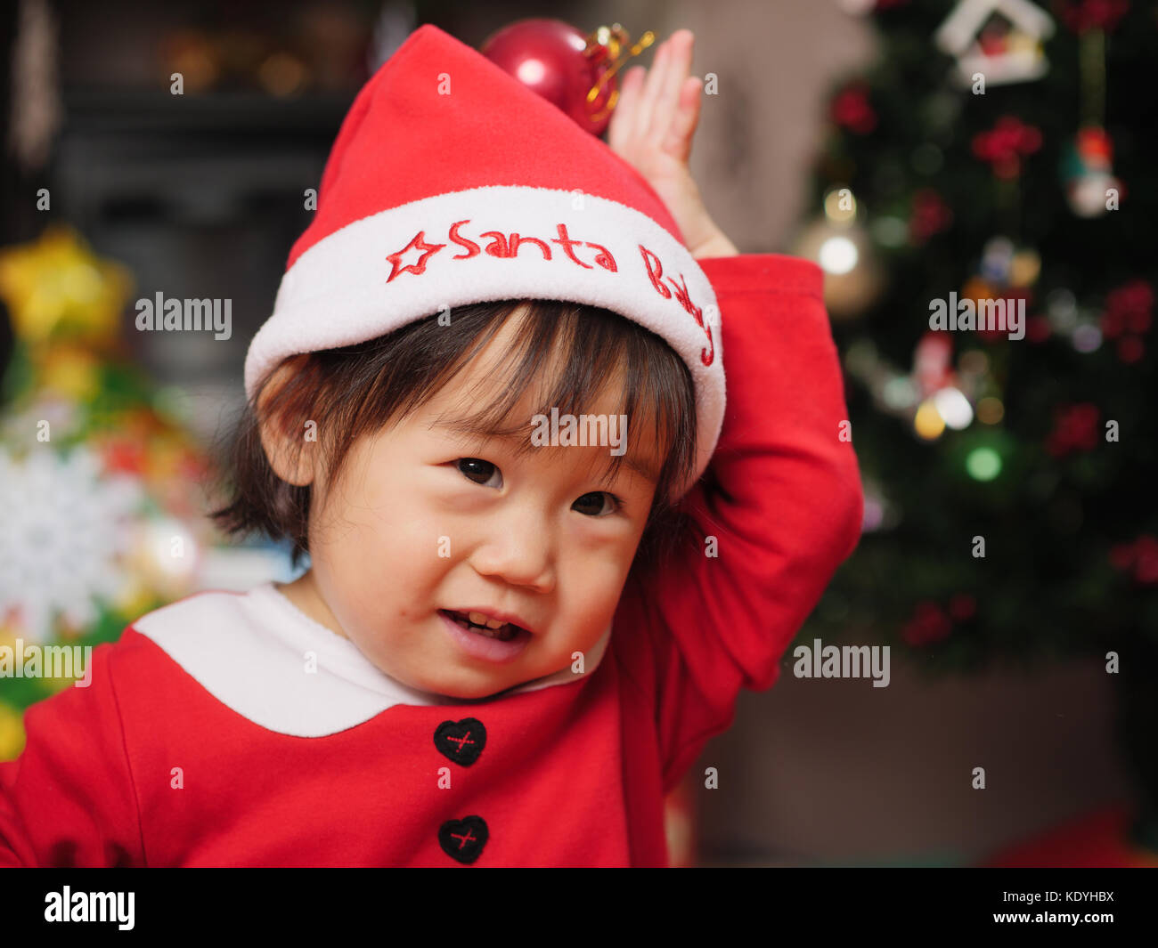 happy santa baby girl at home Stock Photo - Alamy