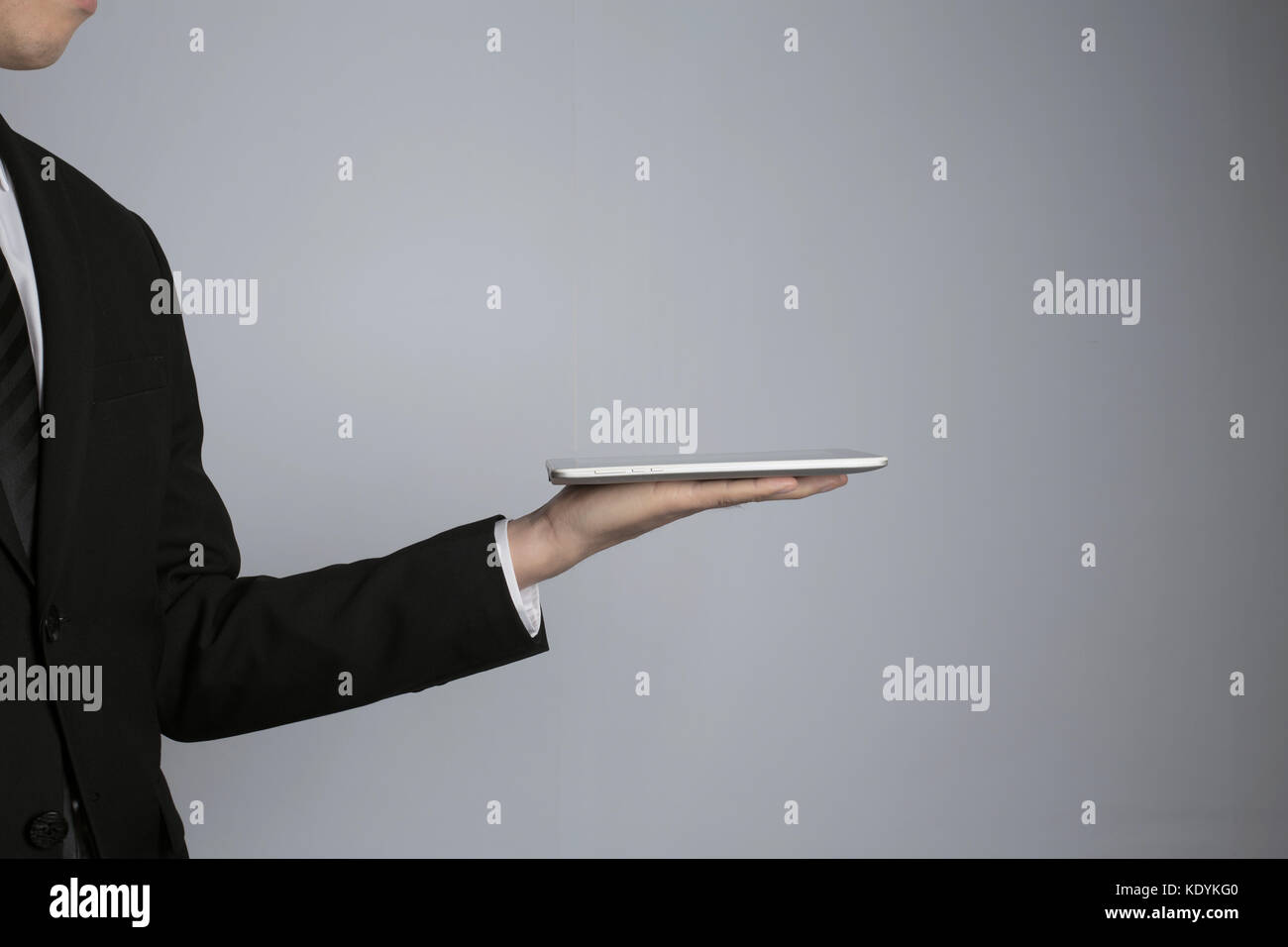 Business man holding a pad Stock Photo - Alamy