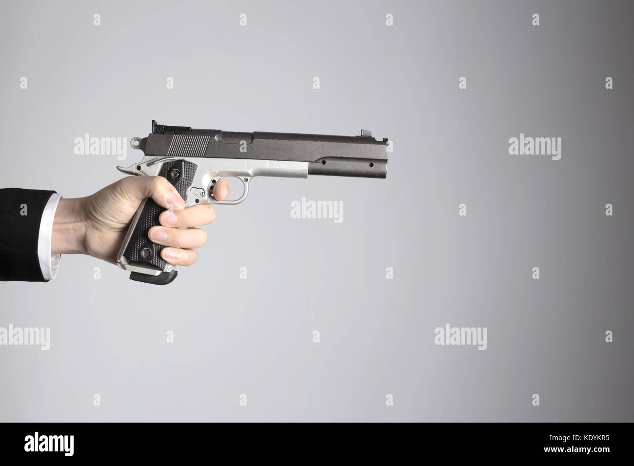 hand with gun Stock Photo - Alamy