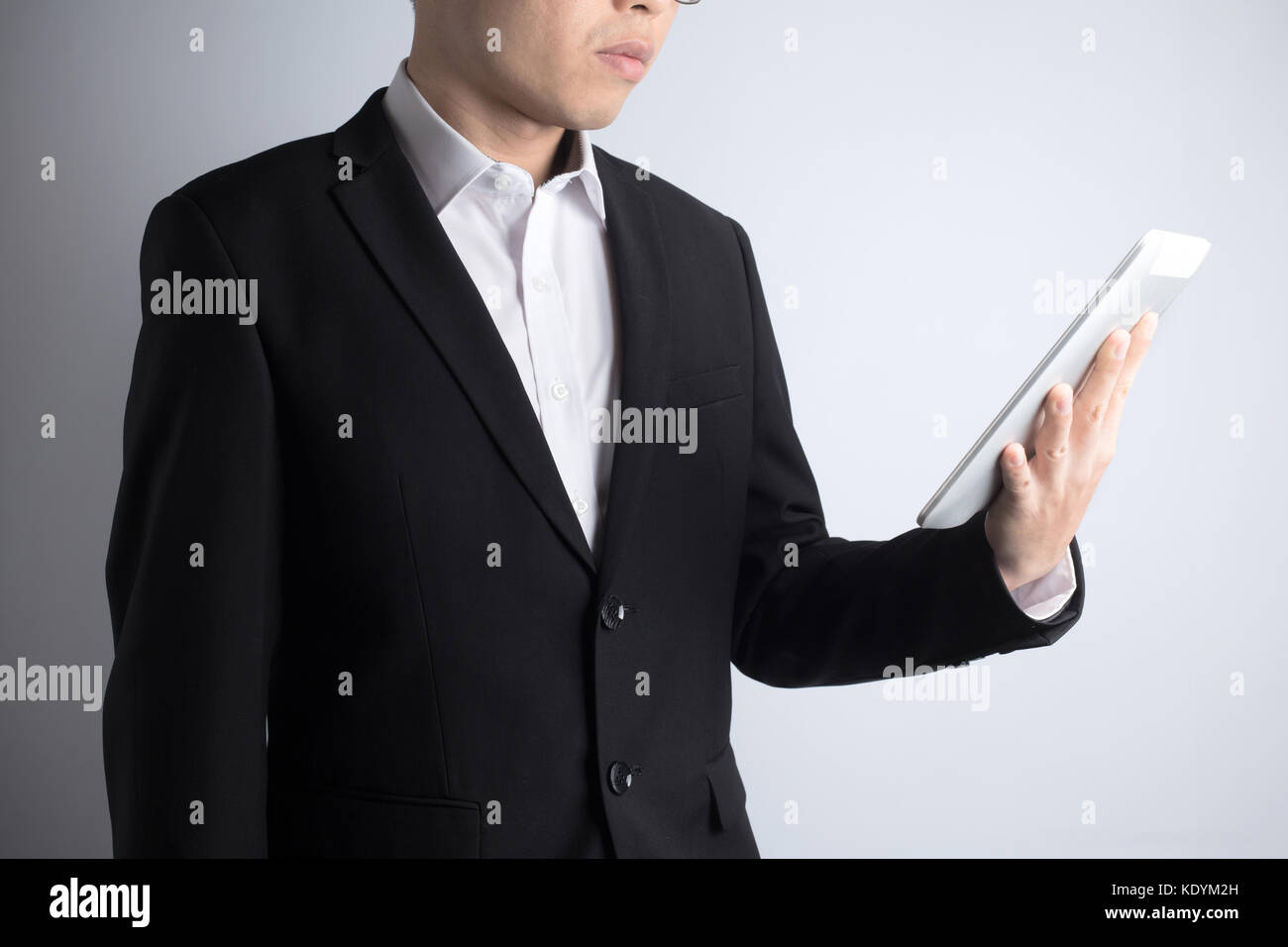 Business man holding a pad Stock Photo - Alamy