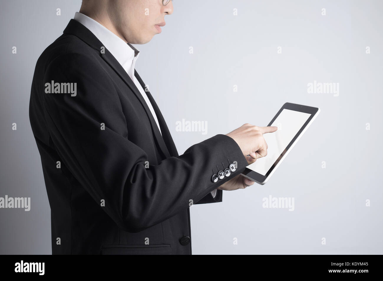 Business man holding a pad Stock Photo - Alamy