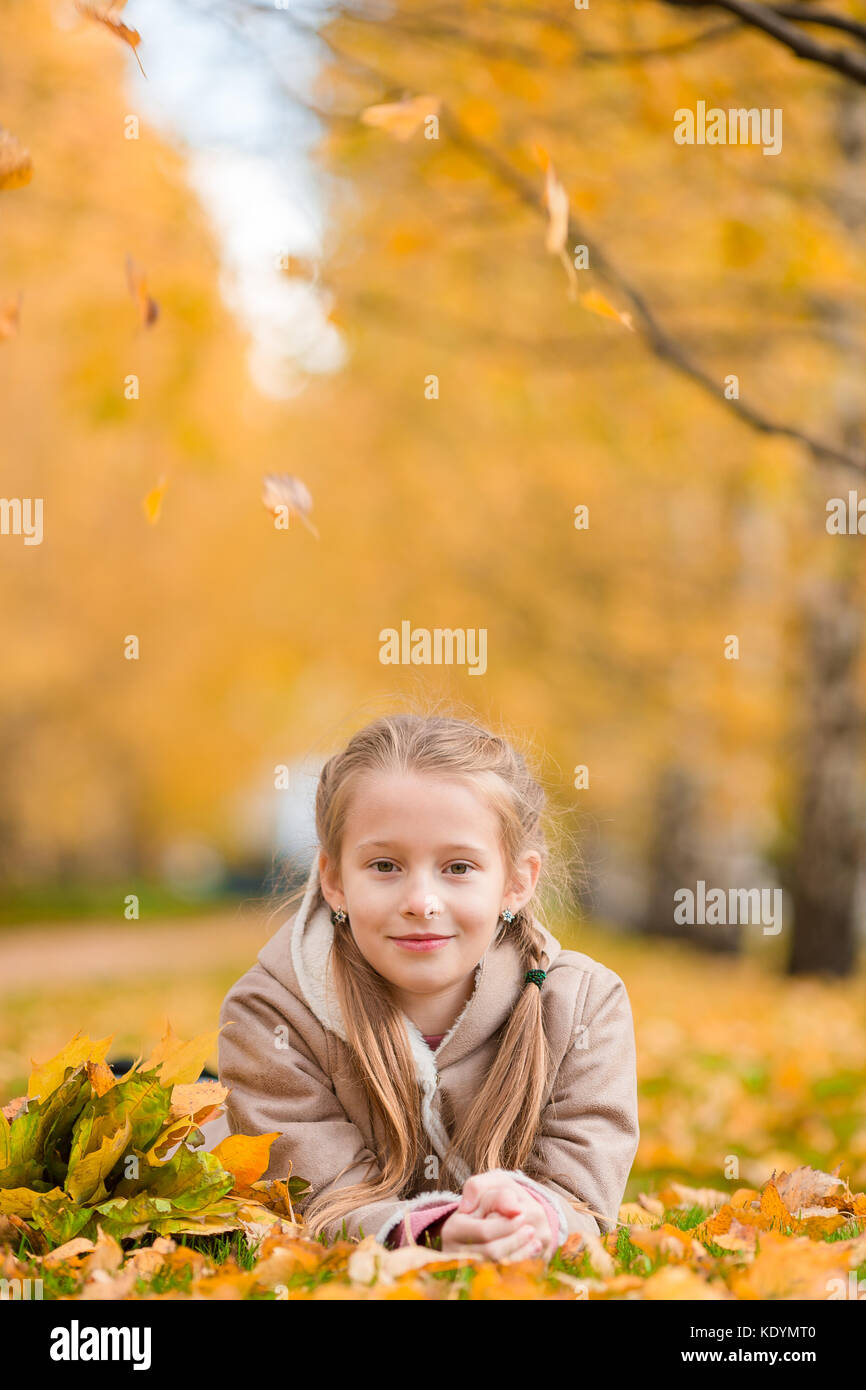 Adorable little girl at beautiful autumn day outdoors Stock Photo - Alamy