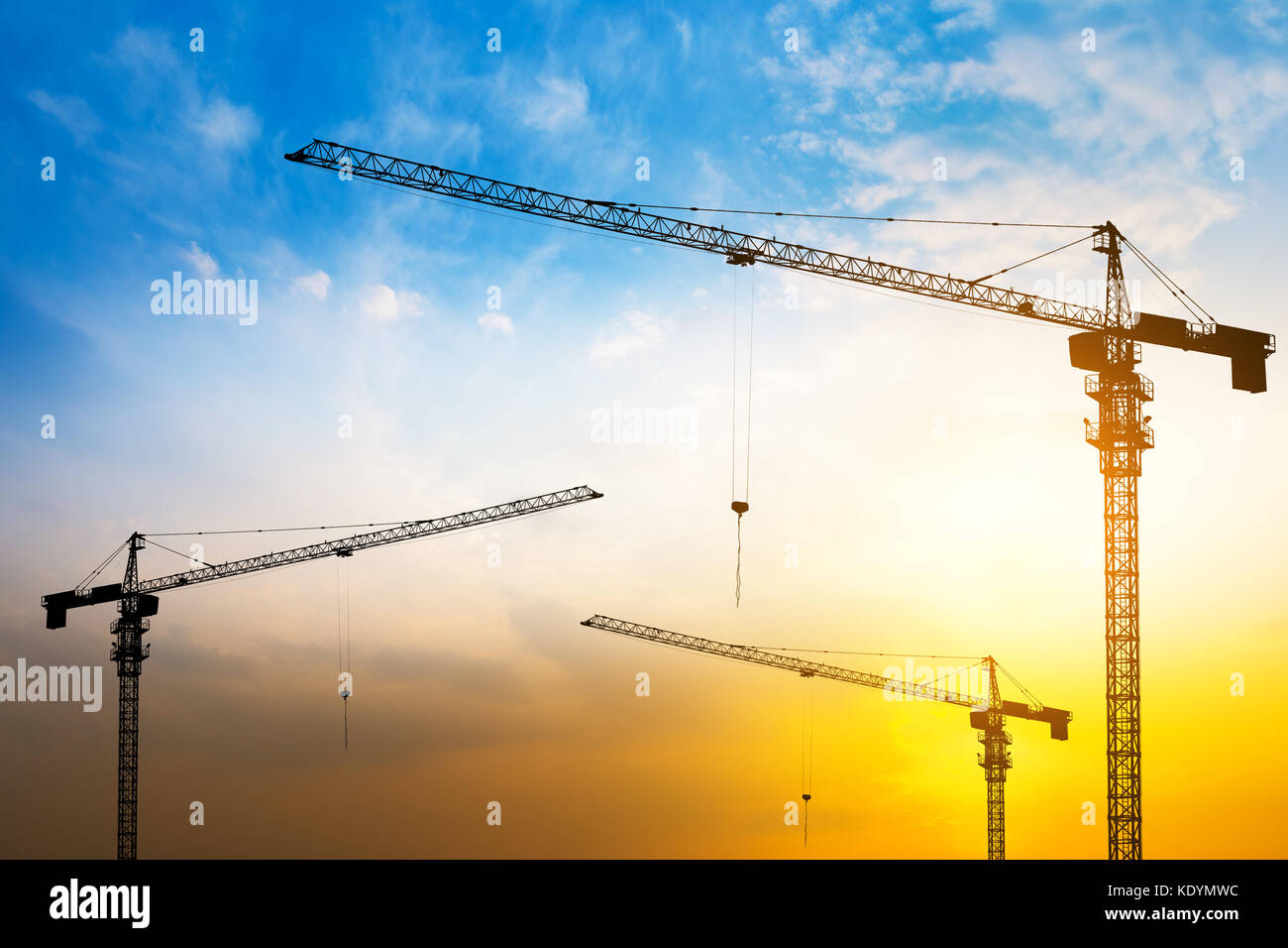 Abstract Industrial background with construction cranes silhouettes ...