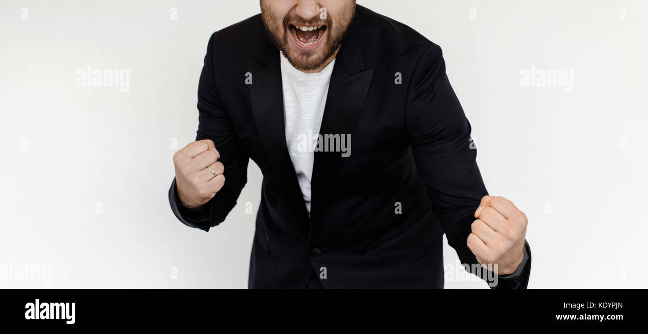 Man in suit celebrating on a white background Stock Photo - Alamy