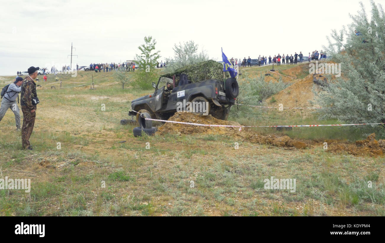 Moscow, Russia 9 June: SUVs race on dirt. Driver competing in an off ...