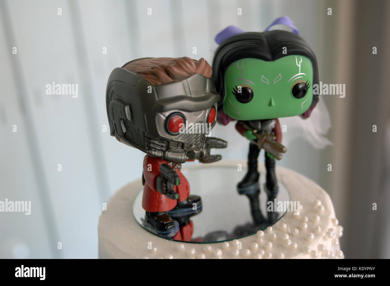 Figure of Ant man and Gamora on wedding cake Stock Photo - Alamy