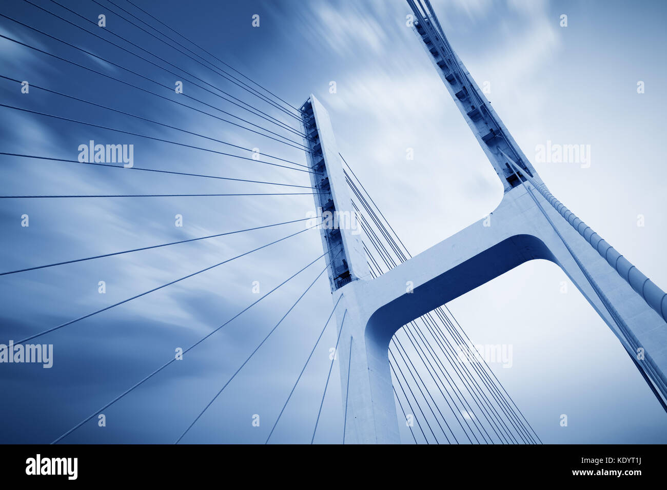 Modern bridge cables, twilight landscape Stock Photo - Alamy