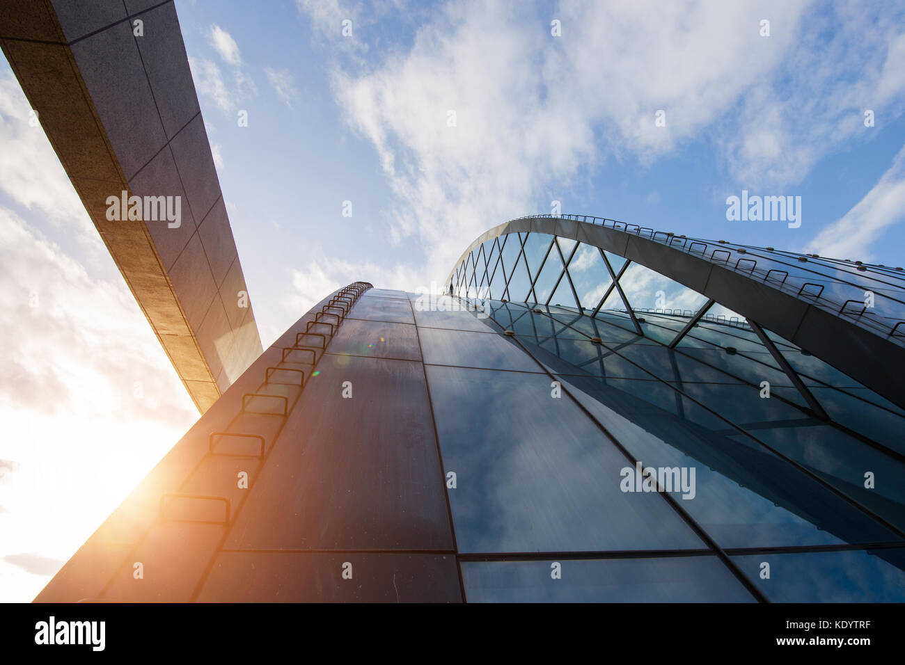 Bright outlook for business. Modern office block with sunny beautiful ...