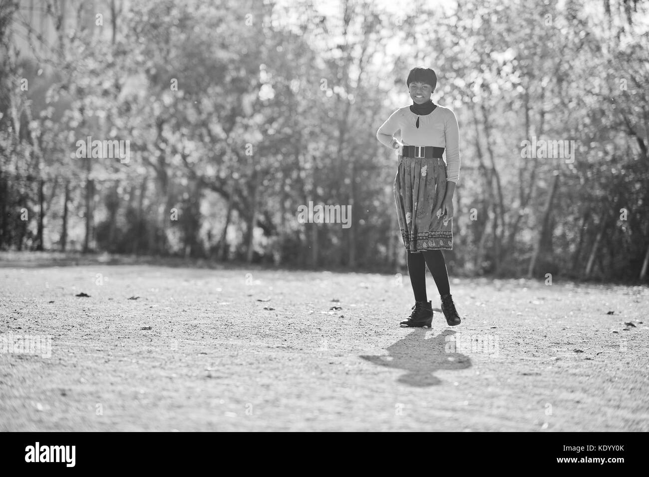 African american girl at yellow and red dress at golden autumn fall ...
