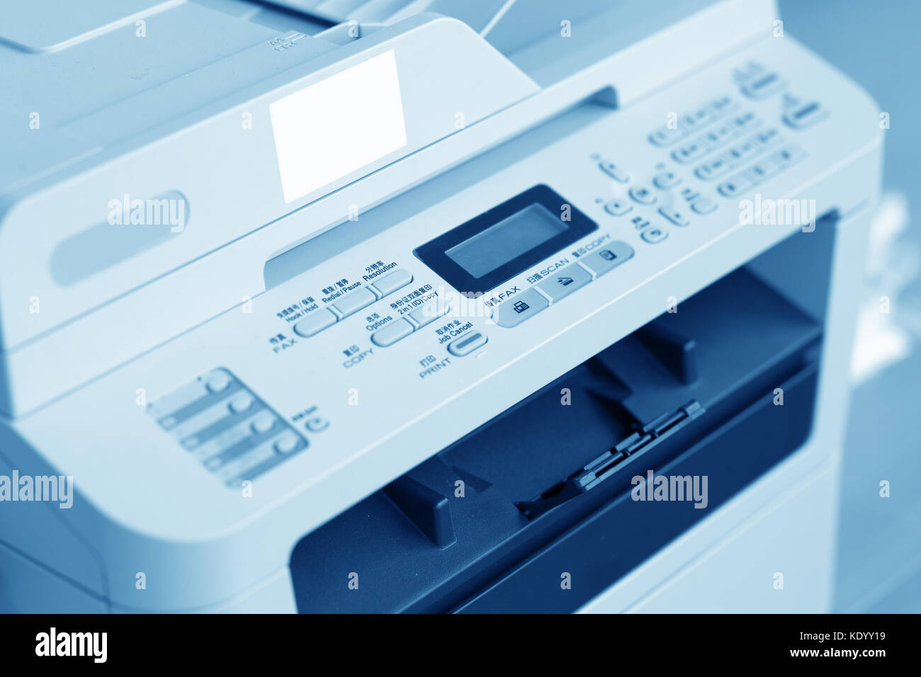 Man holding finger on start button of laser printer Stock Photo - Alamy